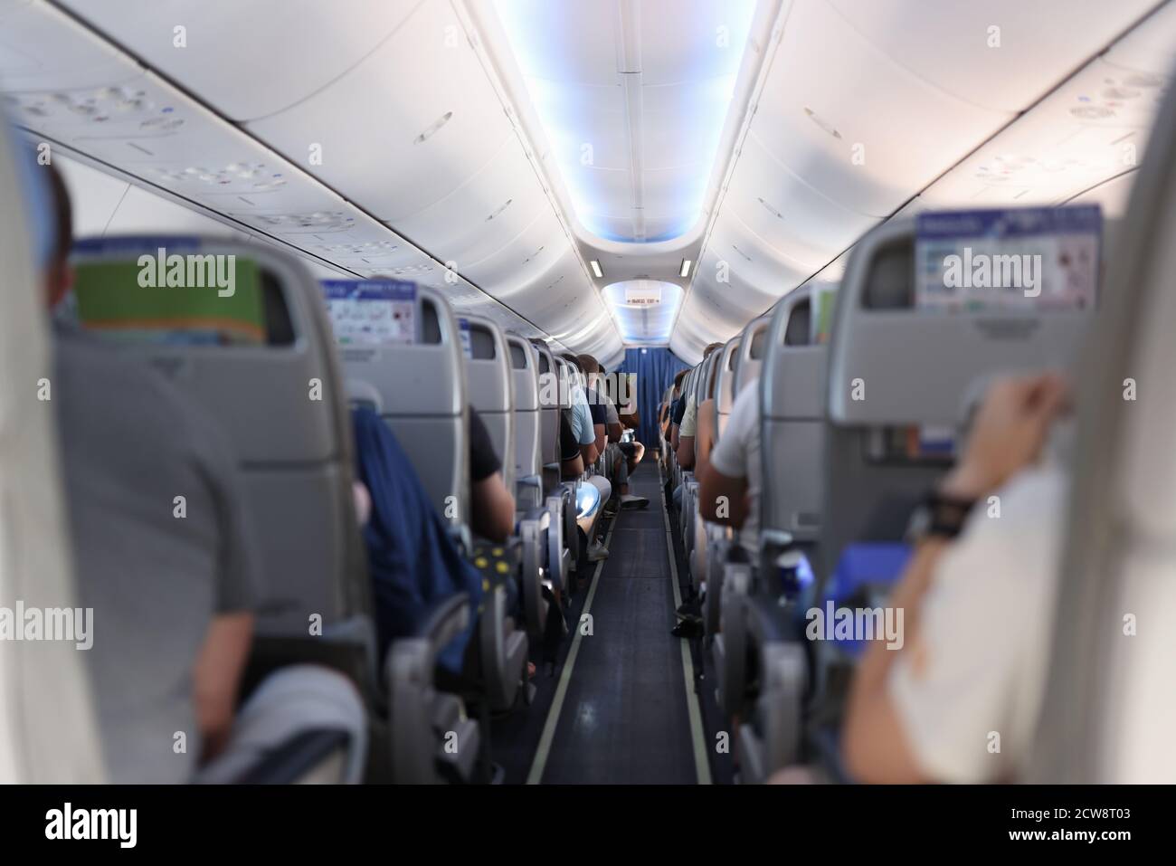 In cabin of the plane are passengers preparing for flight Stock Photo ...
