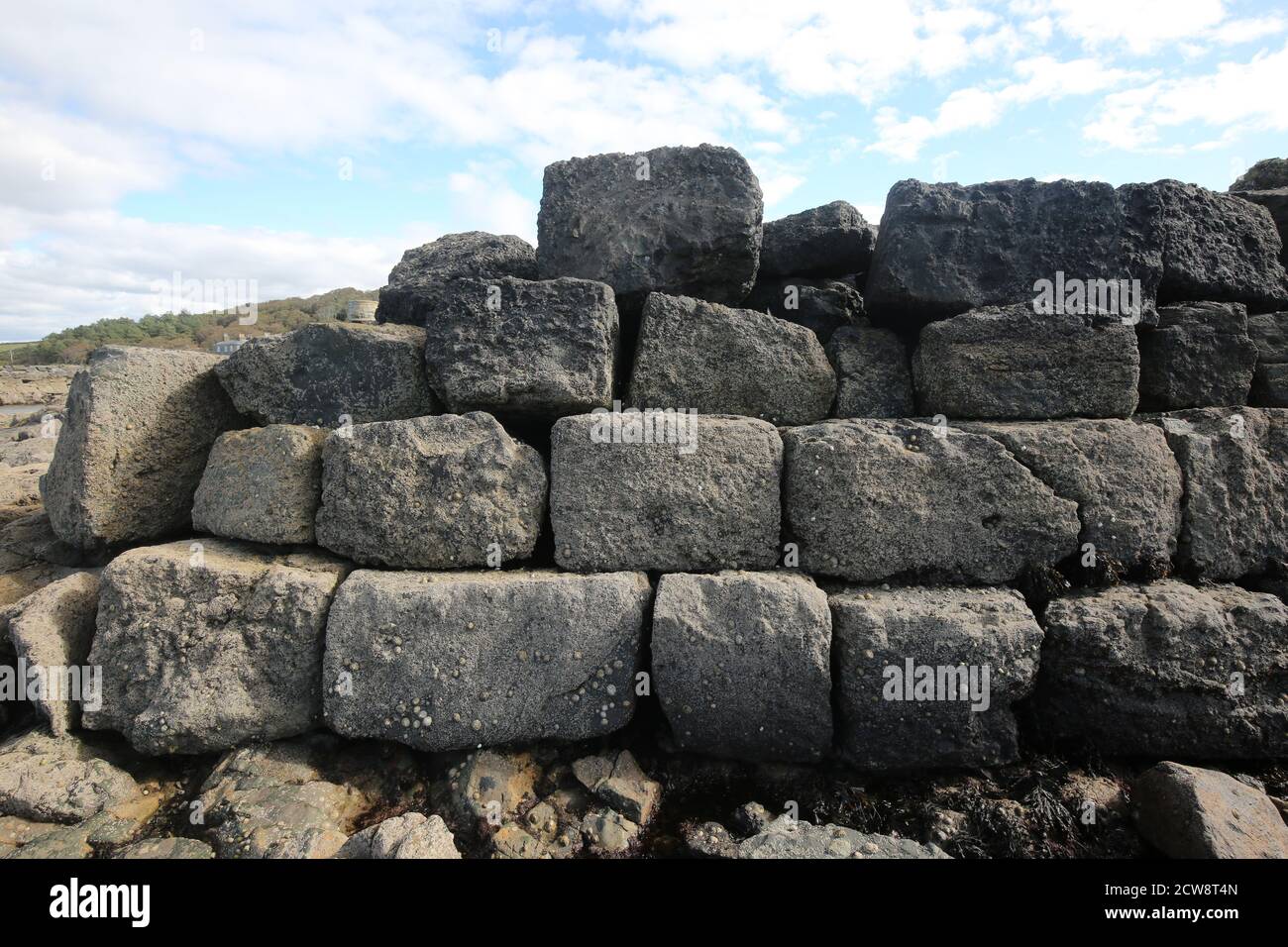 Dunure, Ayrshire, Scotland, UK. Sea defences made from rocks and blocks ...