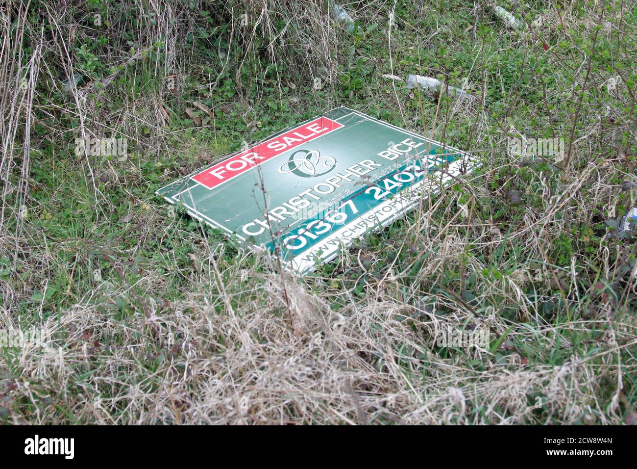 For Sale sign discarded in wasteland Stock Photo - Alamy