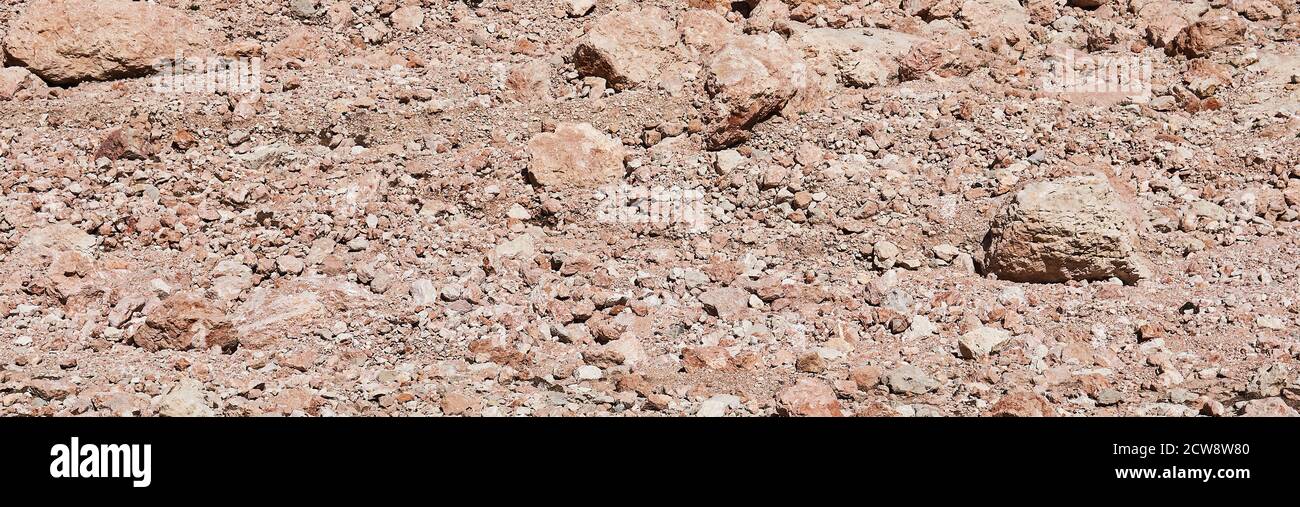 lifeless bed of a melted glacier of reddish stones, reminiscent of a ...