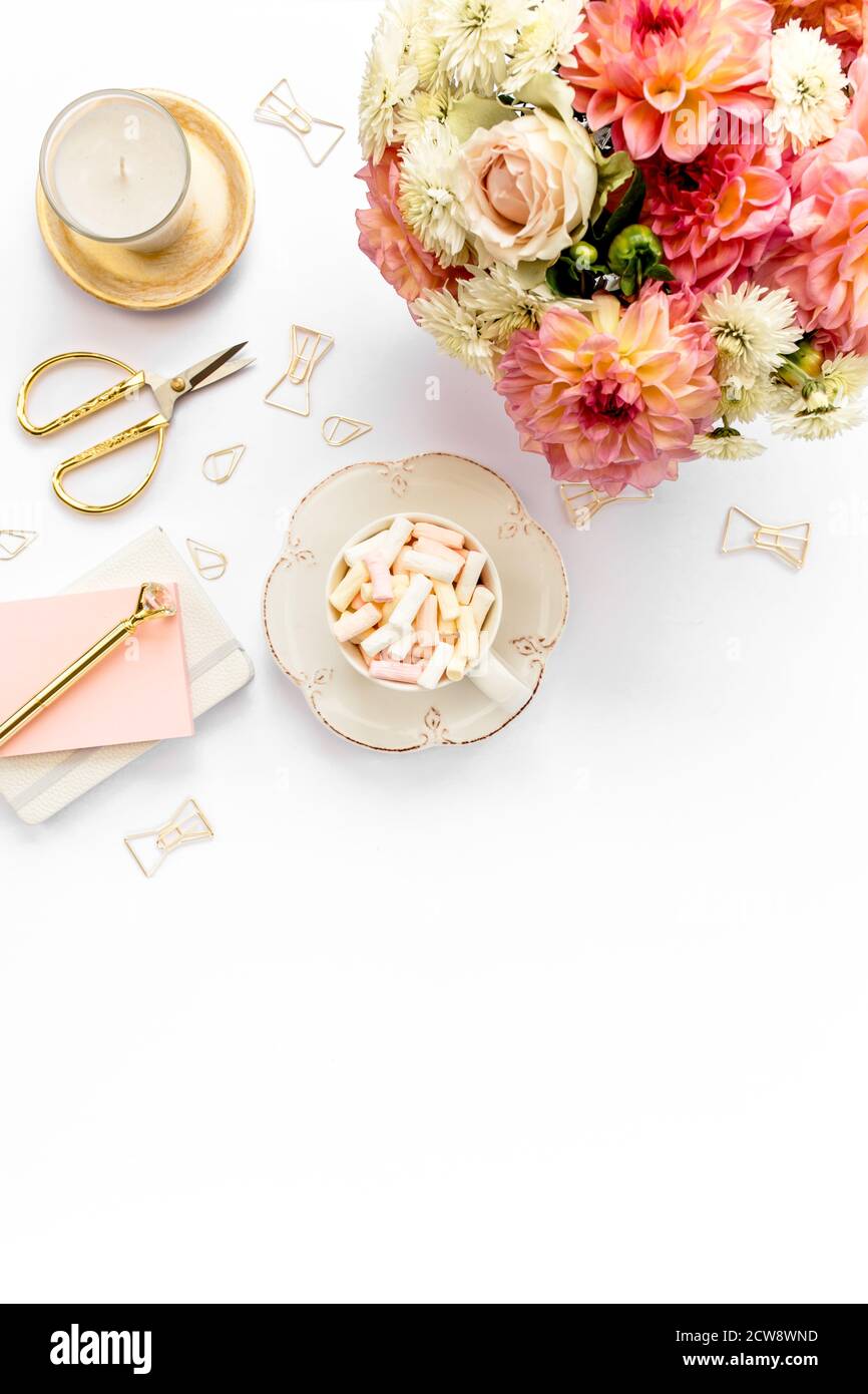 Flat lay home office desk. Female workspace with pink roses, dahlias ...