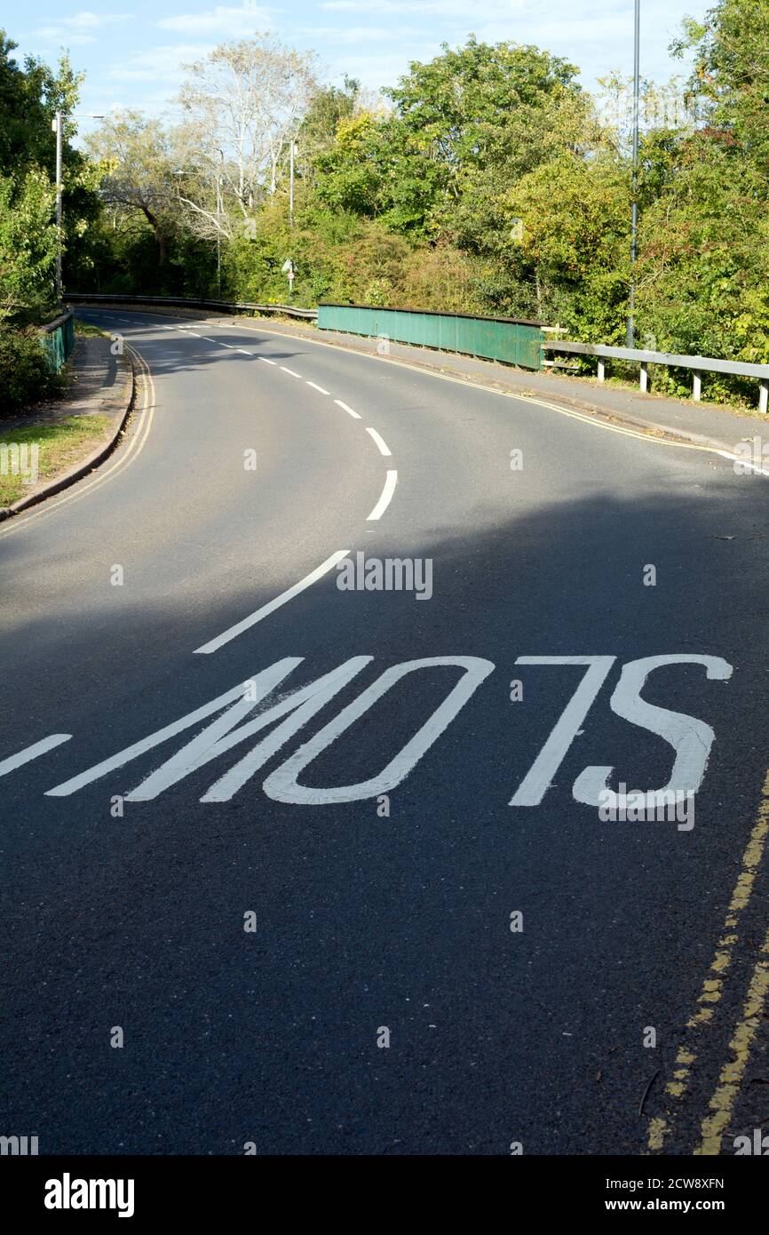 Road marking slow sign painted hi-res stock photography and images - Alamy
