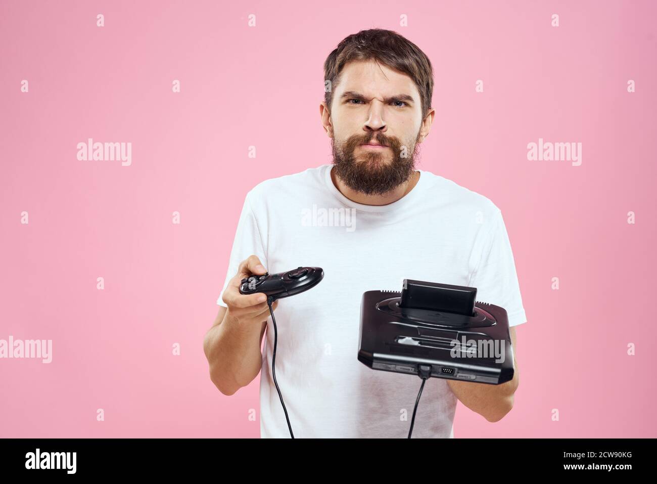 Man with prefix in hand joystick games lifestyle fun pink background ...