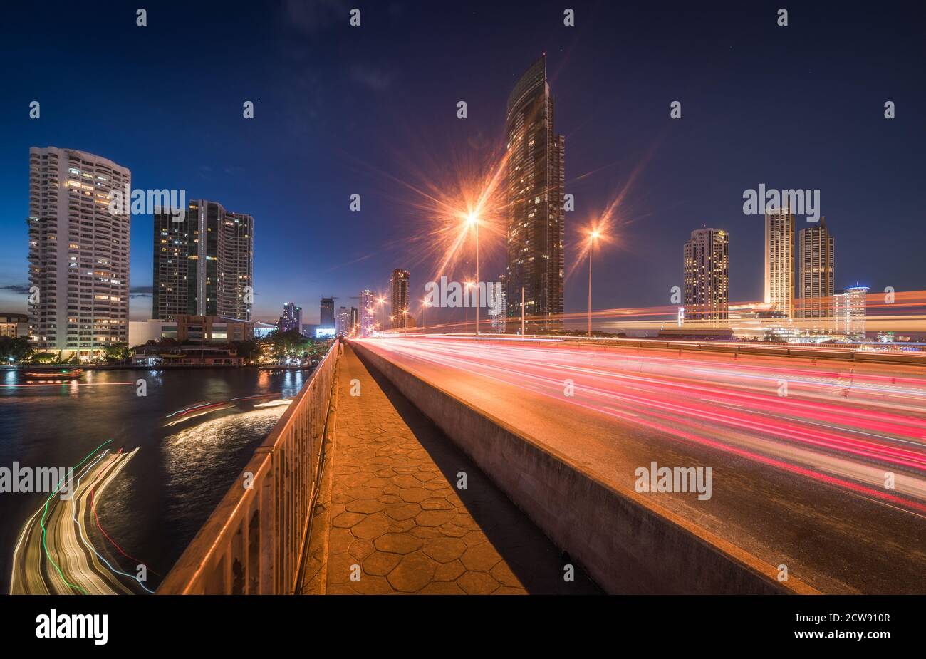 Skyscrapers and Traffic Light Trails on Taksin Bridge Crossing Chao ...