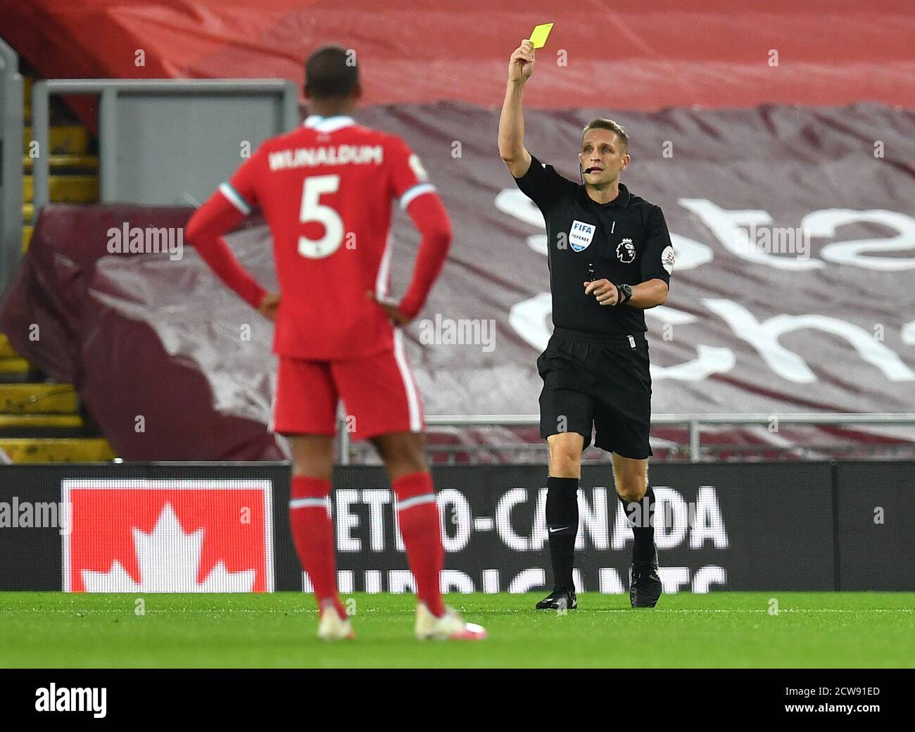 Referee craig pawson shows yellow card hi-res stock photography and images - Alamy