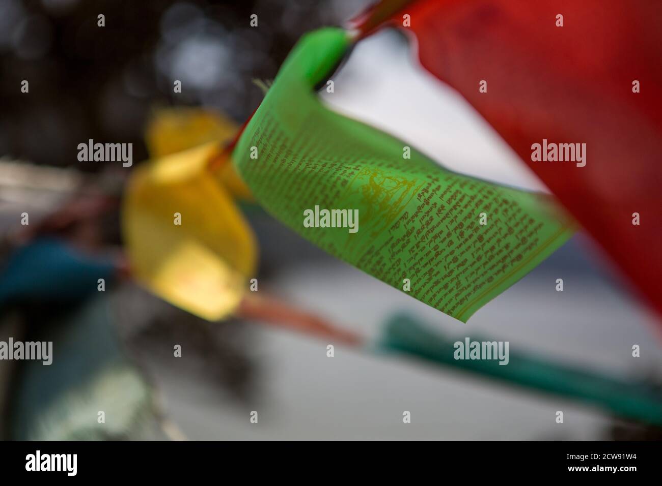 Prayer flags blowing in the wind in China Stock Photo - Alamy