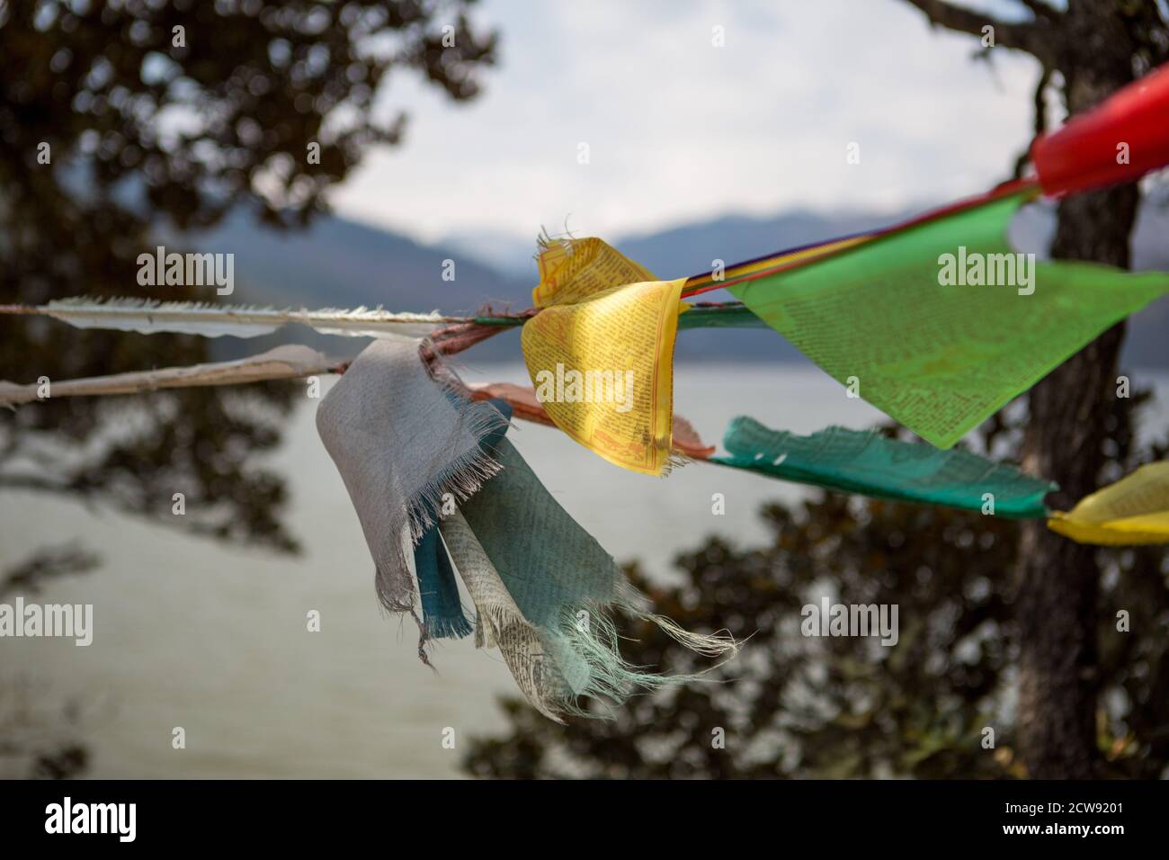 Prayer flags blowing in the wind in China Stock Photo - Alamy