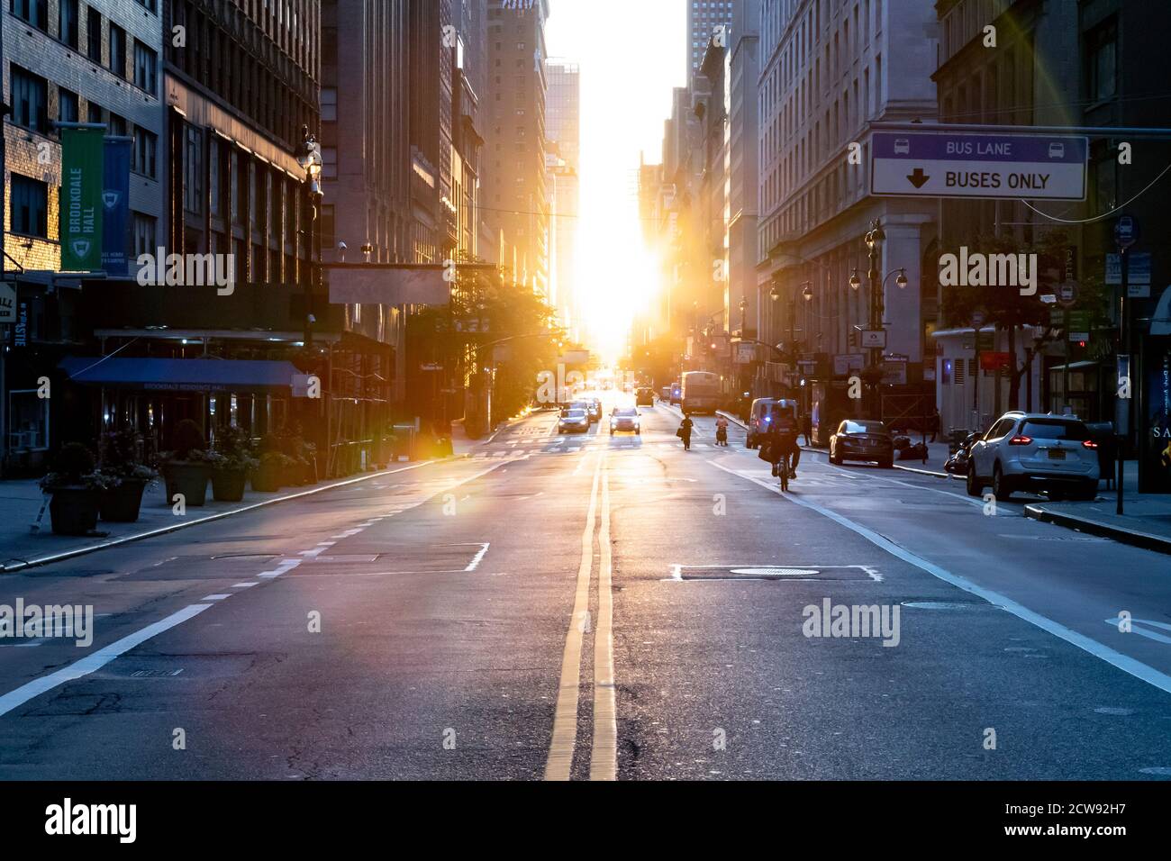 New York City 2020: The light of sunset shines between the buildings ...