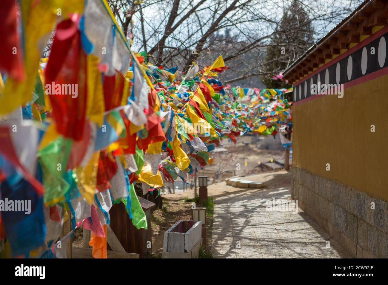 Prayer flags blowing in the wind in China Stock Photo - Alamy