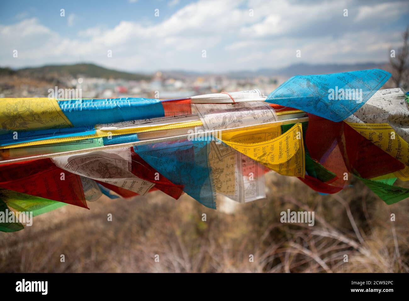 Prayer flags blowing in the wind in China Stock Photo - Alamy