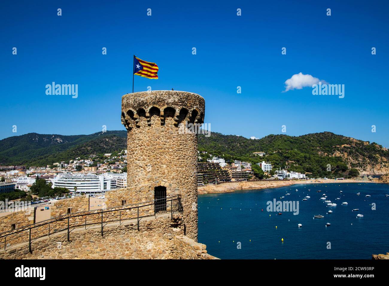 The Catalan independence flag flying from the medieval castle walls in ...