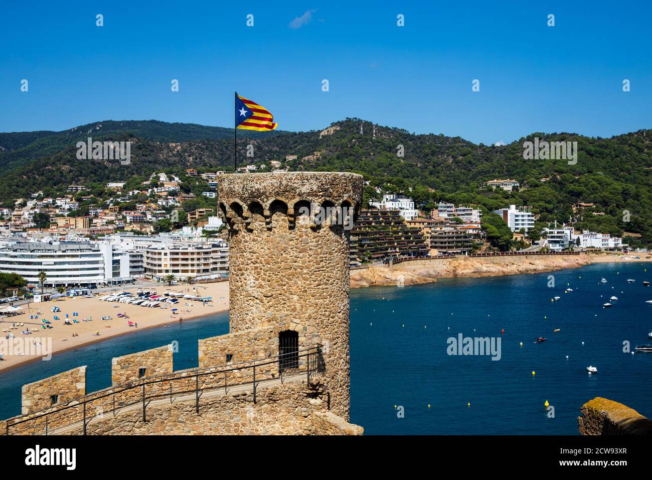 The Catalan independence flag flying from the medieval castle walls in ...