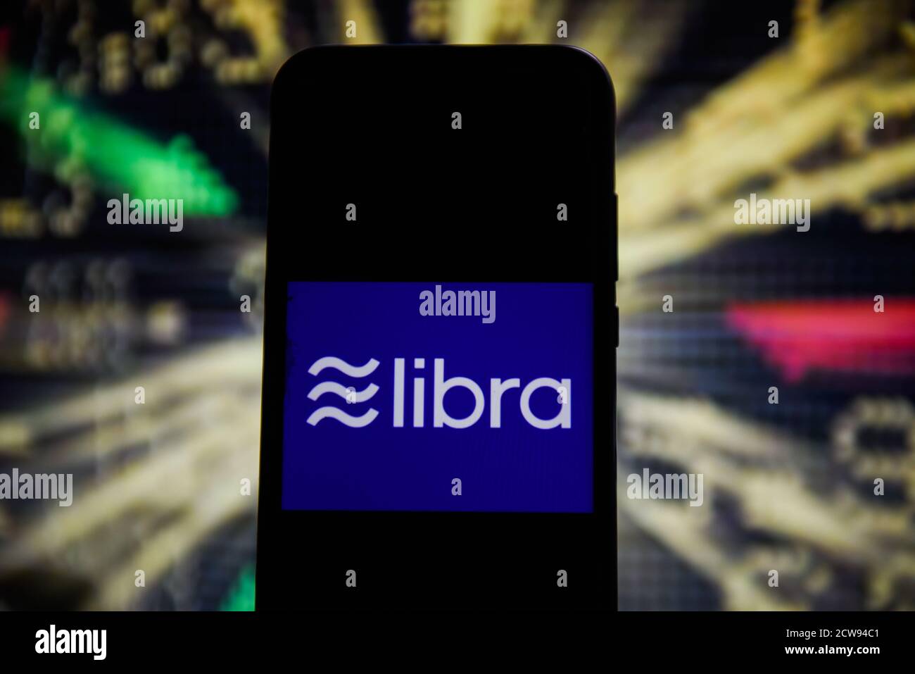In this photo illustration a Facebook libra logo is seen displayed on a ...