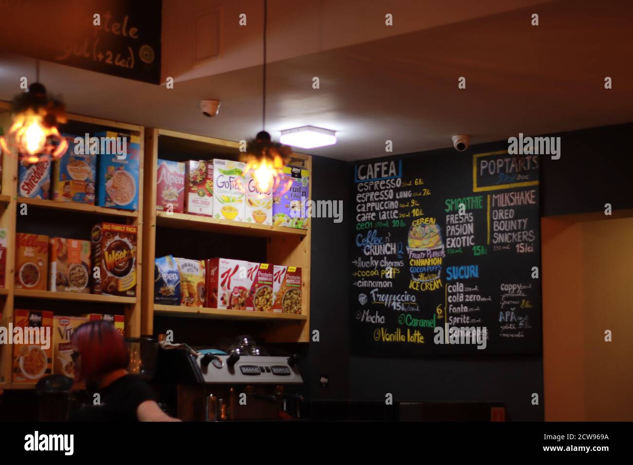 Types of Cereals on display in a coffee shop, milk and cereal shop ...