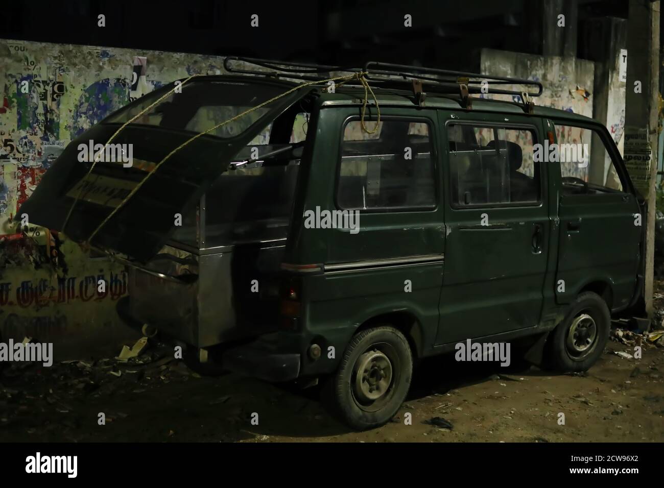 Side view of a mini van parking at nights Stock Photo - Alamy