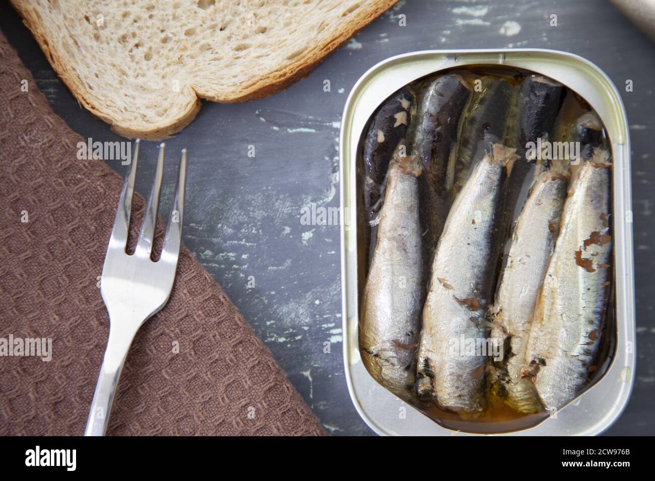 Closeup shot of tuna fish in a plastic can on the table set Stock Photo ...