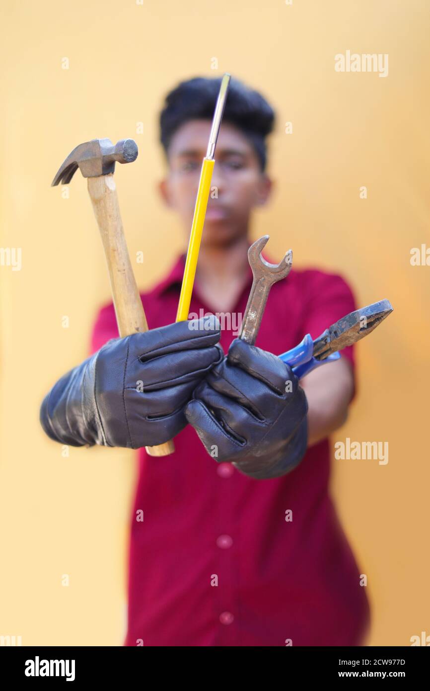 Handsome young man tools hi-res stock photography and images - Alamy