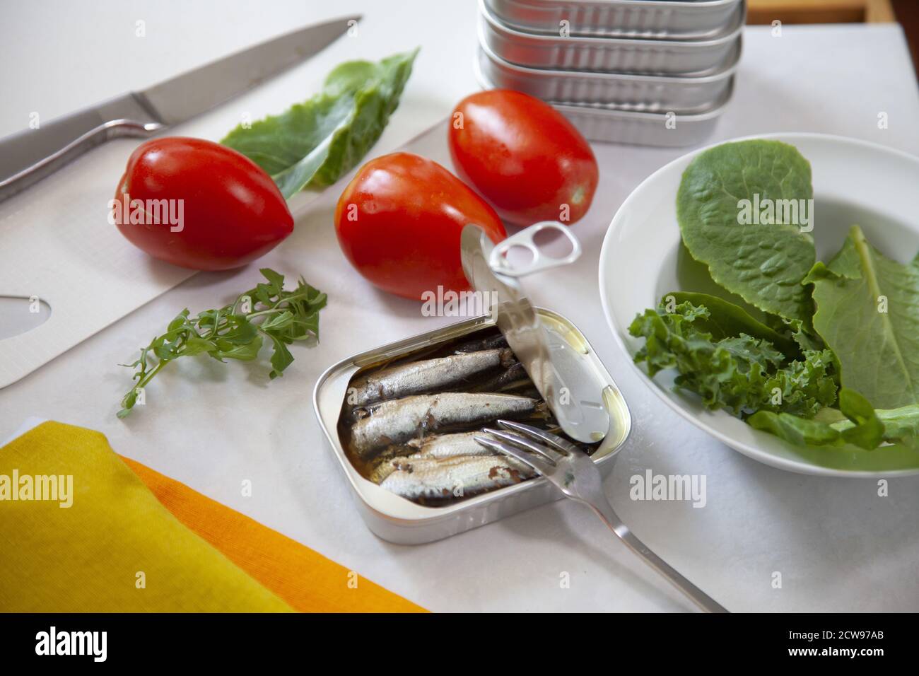 Closeup shot of tuna fish in a plastic can on the table set Stock Photo ...