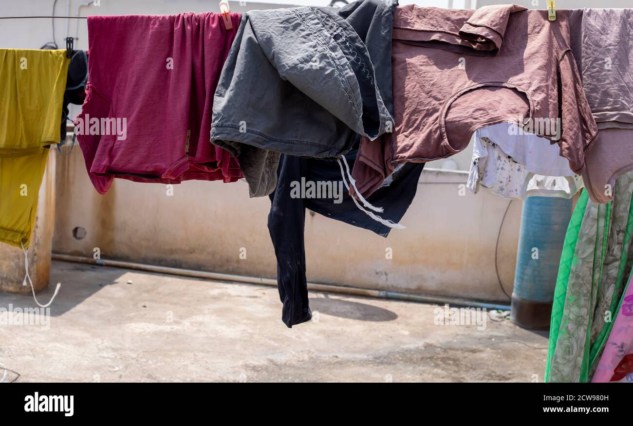 Clean clothes hanging for dry. Home activity, laundry Stock Photo - Alamy