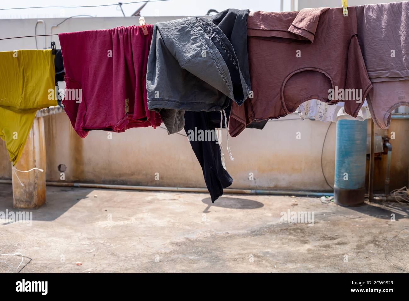 Clean clothes hanging for dry. Home activity, laundry Stock Photo - Alamy