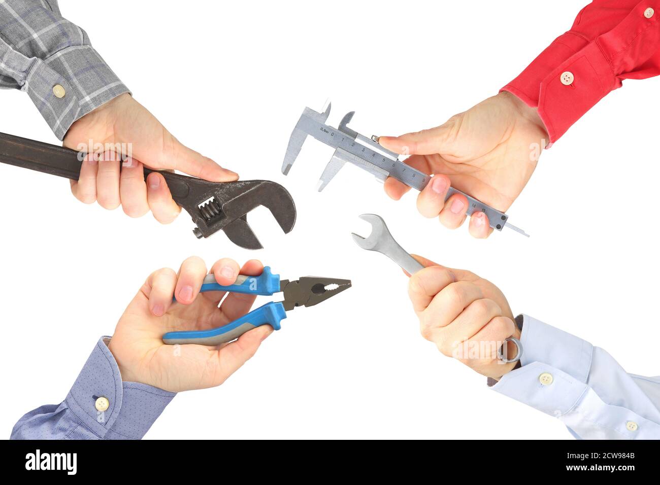 Hands with different working tools on white background. Industry and ...