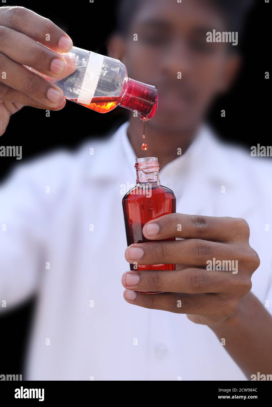 Scientist holds bottle sample hi-res stock photography and images - Alamy