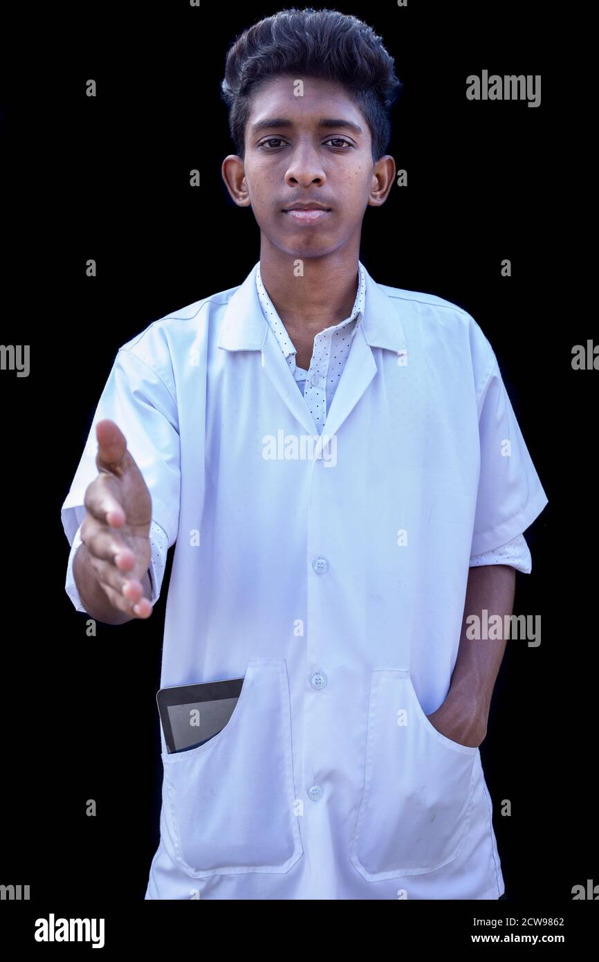 friendly male doctor with open hand ready for handshake on a black ...