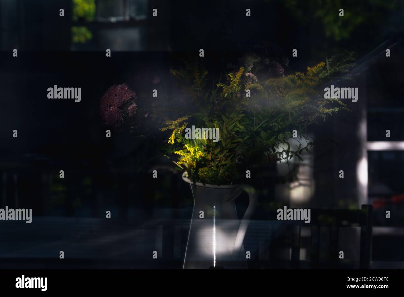 A bouquet of wildflowers inside a home, as seen through a window Stock ...