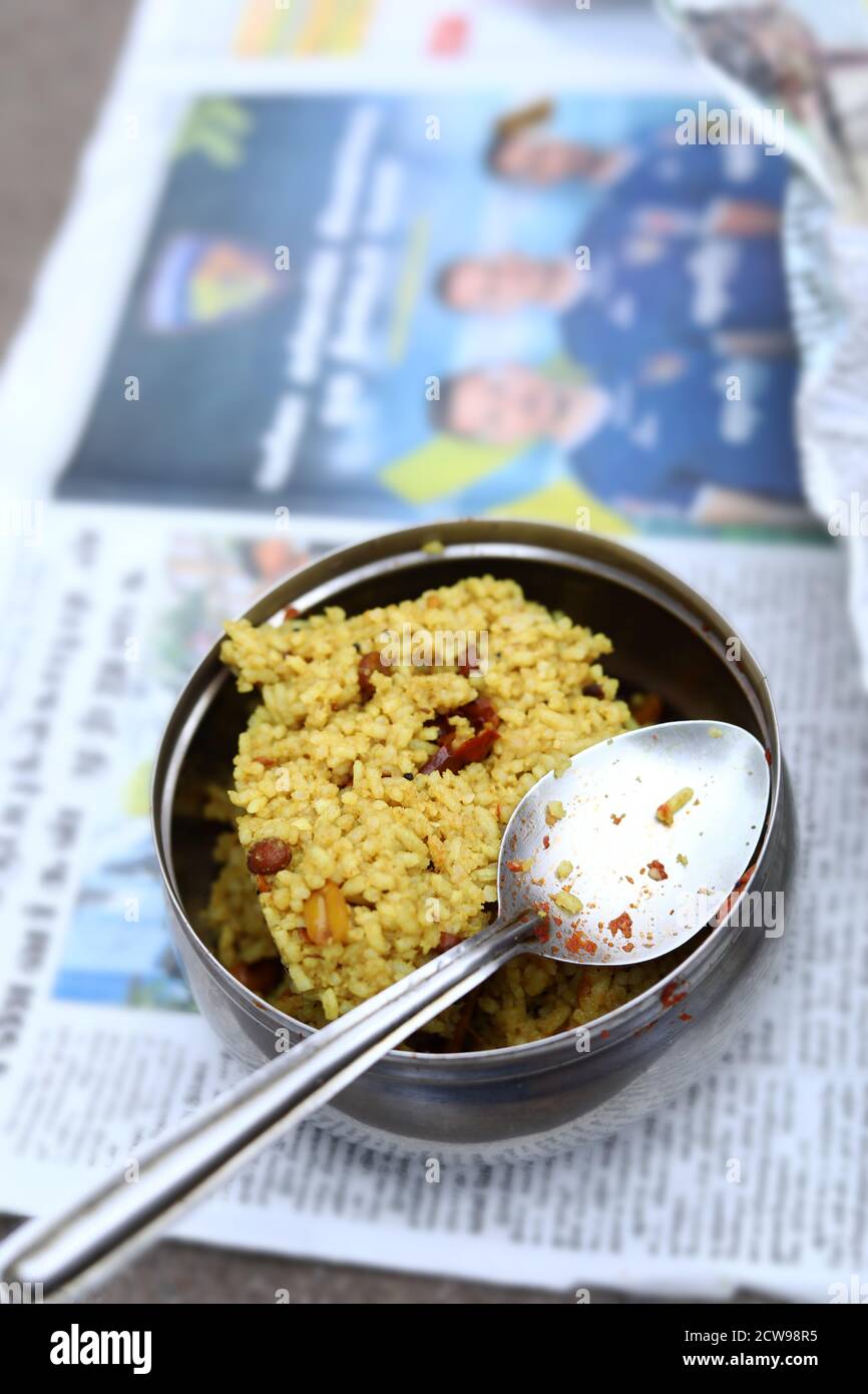 Indian food tamarind rice in a bowls with silver spoon Stock Photo - Alamy