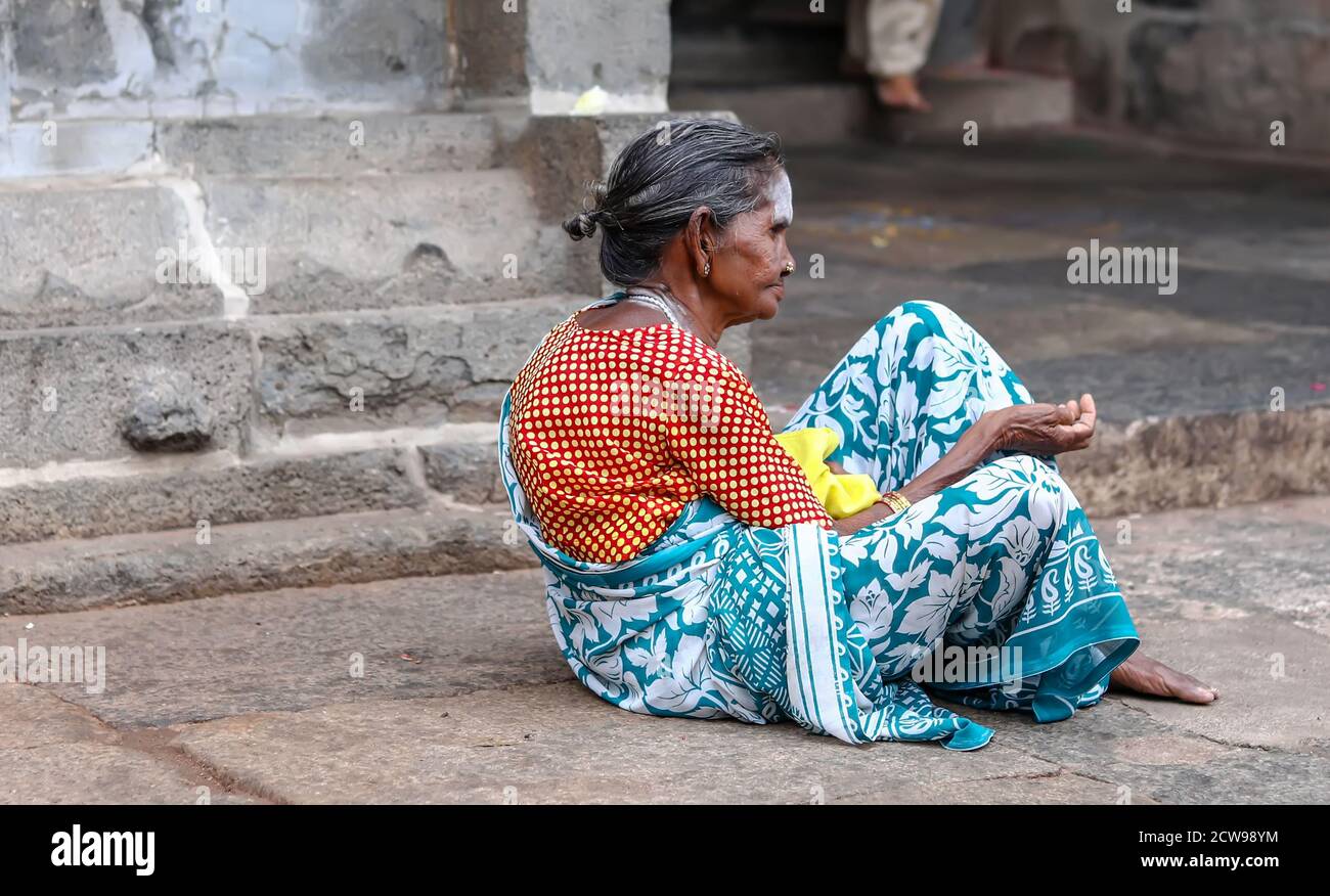 Beggar outside a temple hi-res stock photography and images - Alamy
