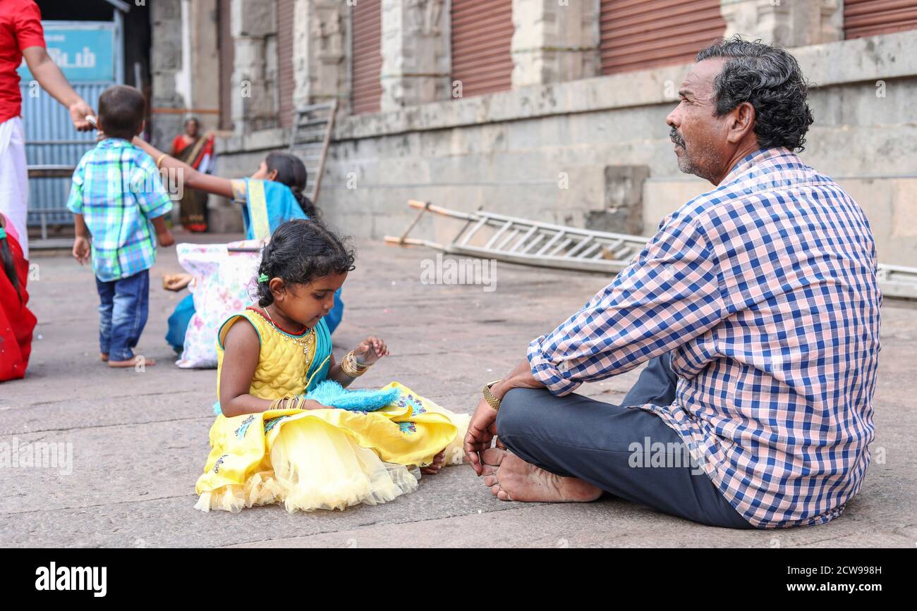 A child playing in front of Hindu Temples Stock Photo - Alamy