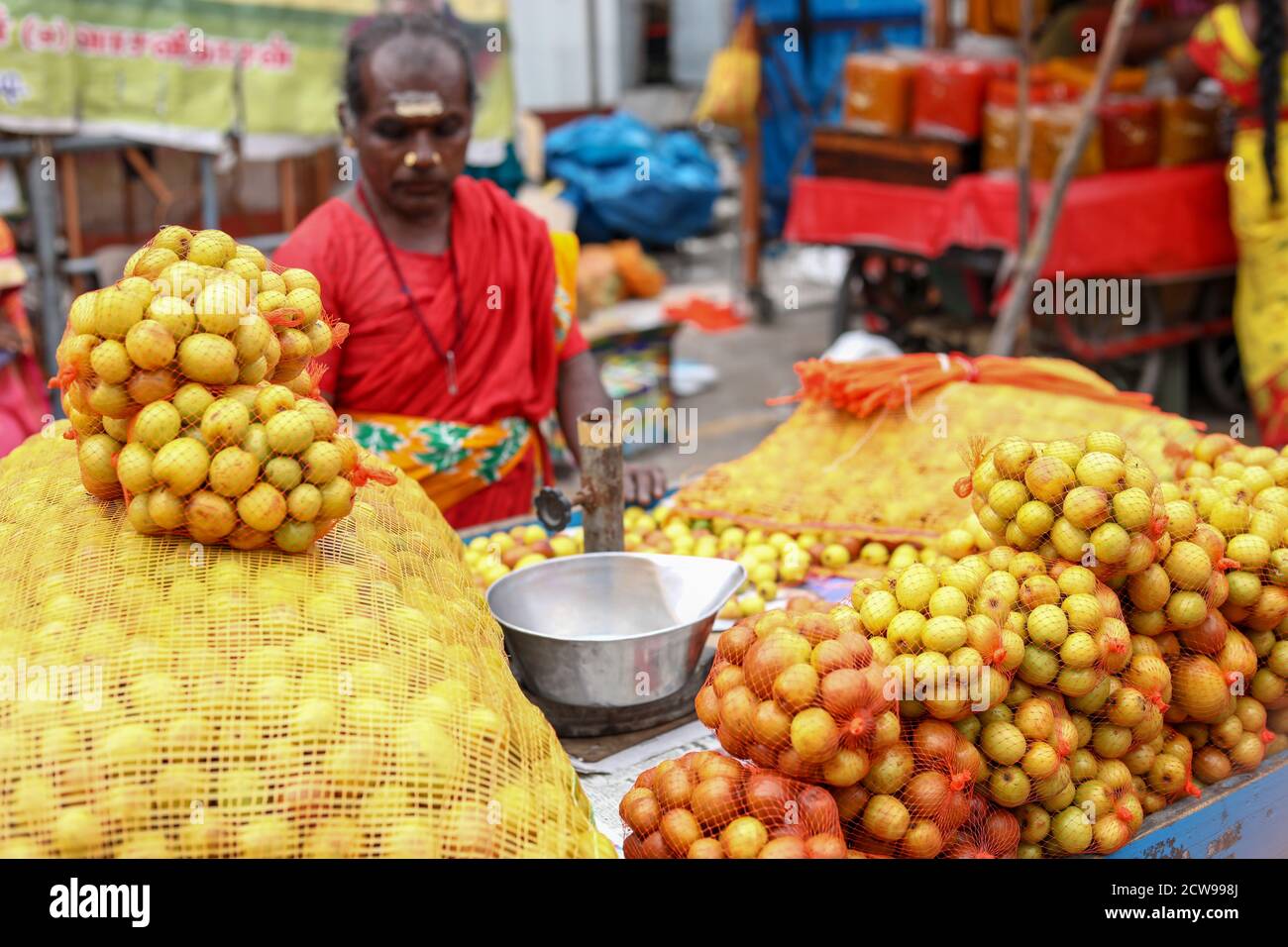 A fruit vendor sells fruits on a streets Stock Photo - Alamy