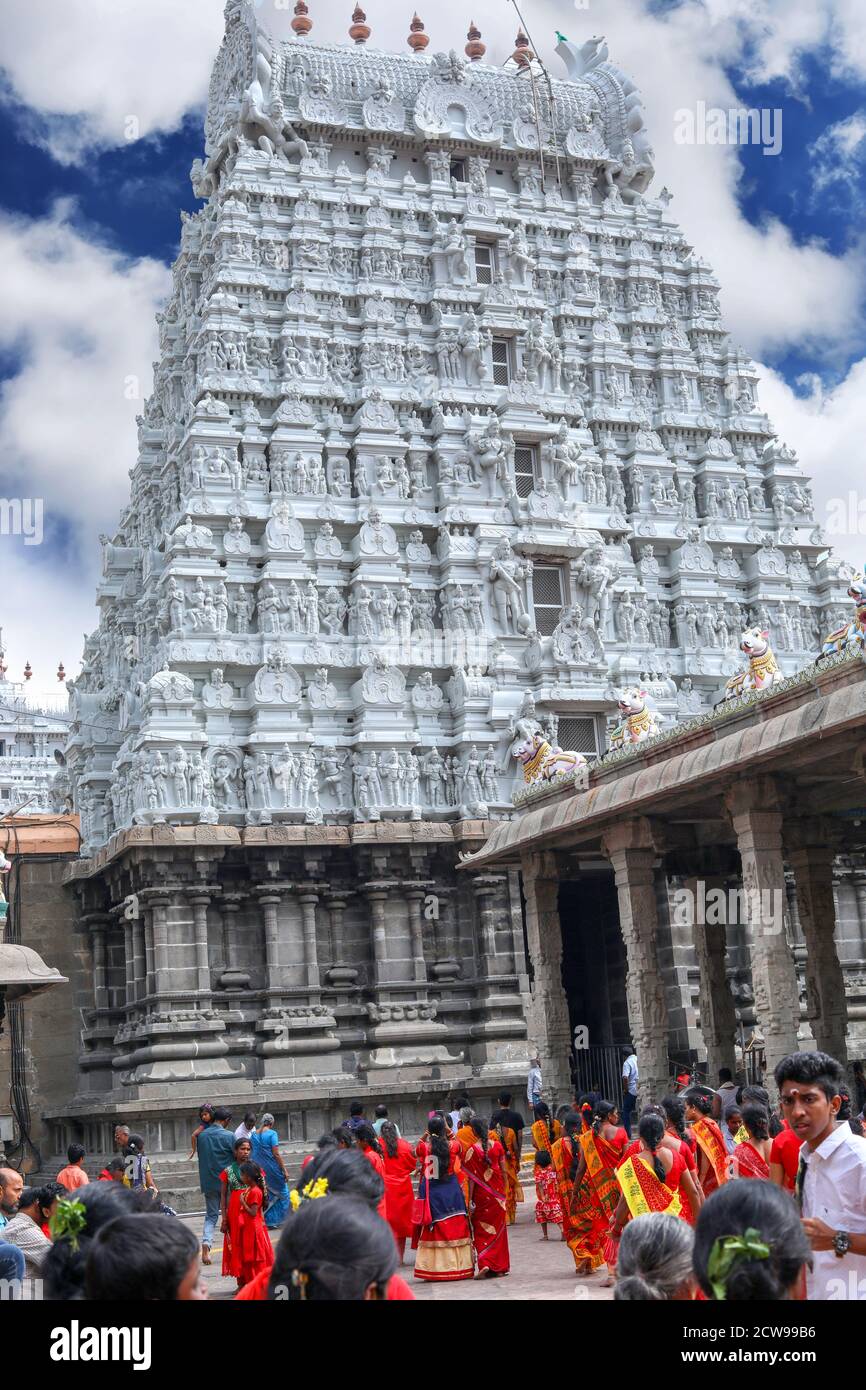 Hindu people walking into a Hindu temple located in India Stock Photo ...