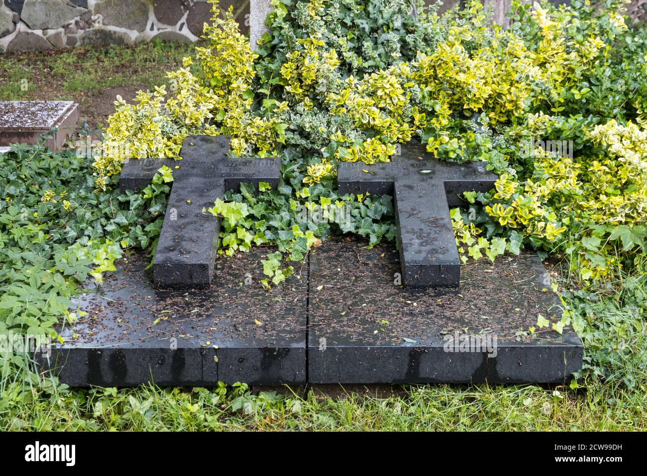 Two crosses on a tombstone Stock Photo - Alamy