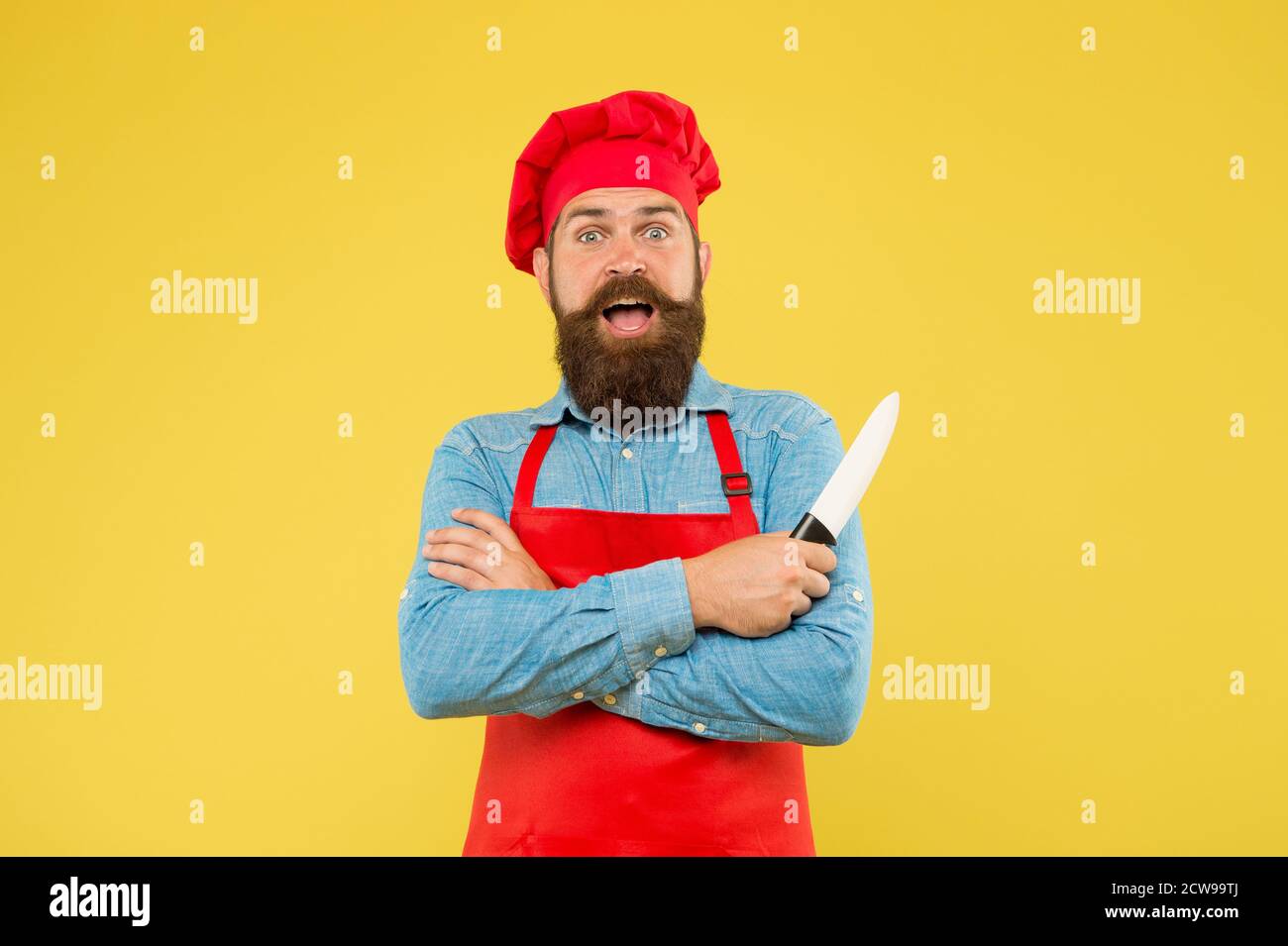 Restaurant food. Hipster handsome cook hold sharp professional knife ...