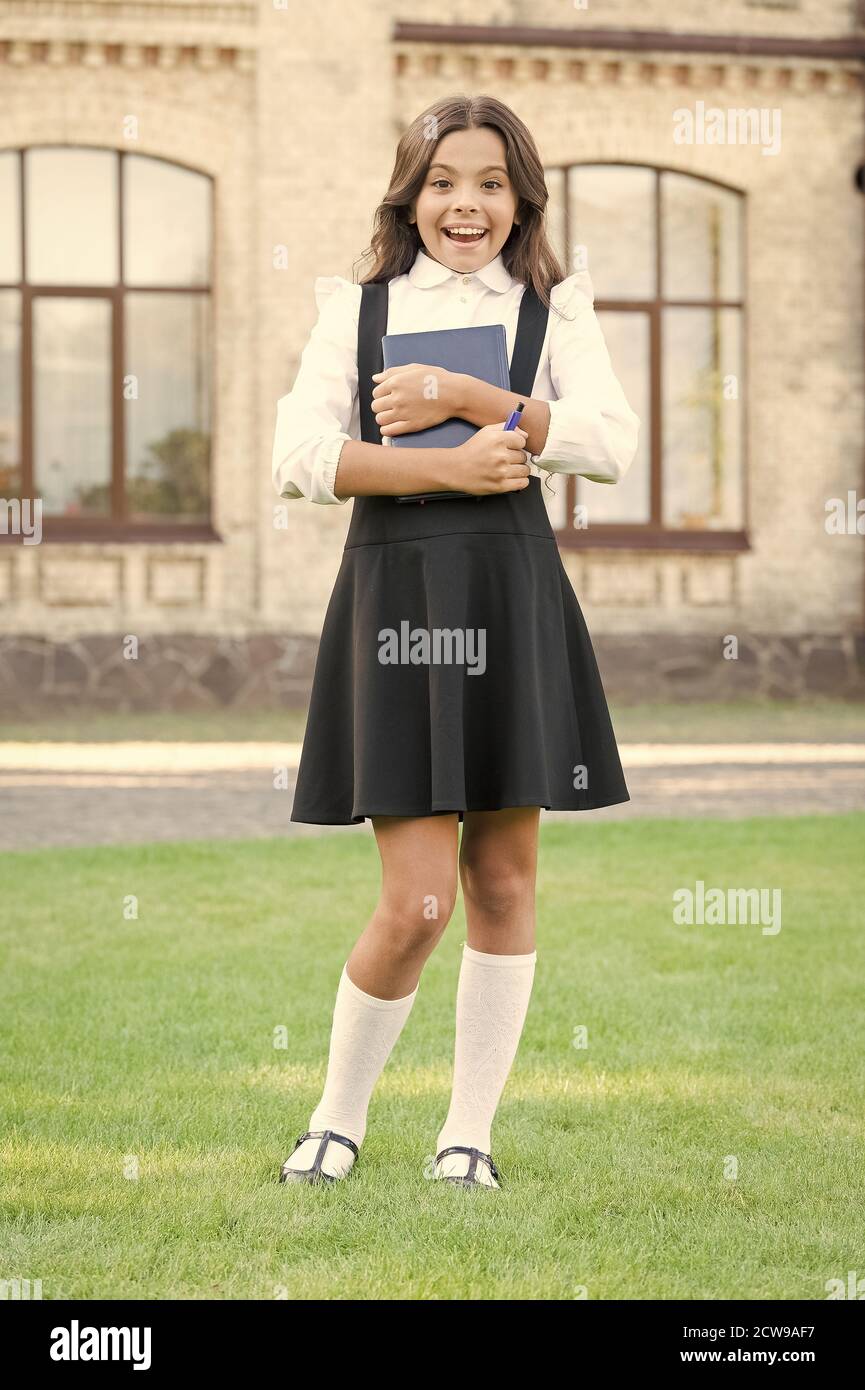 Have necessary knowledge. Demanded knowledge. Cute smiling child hold ...