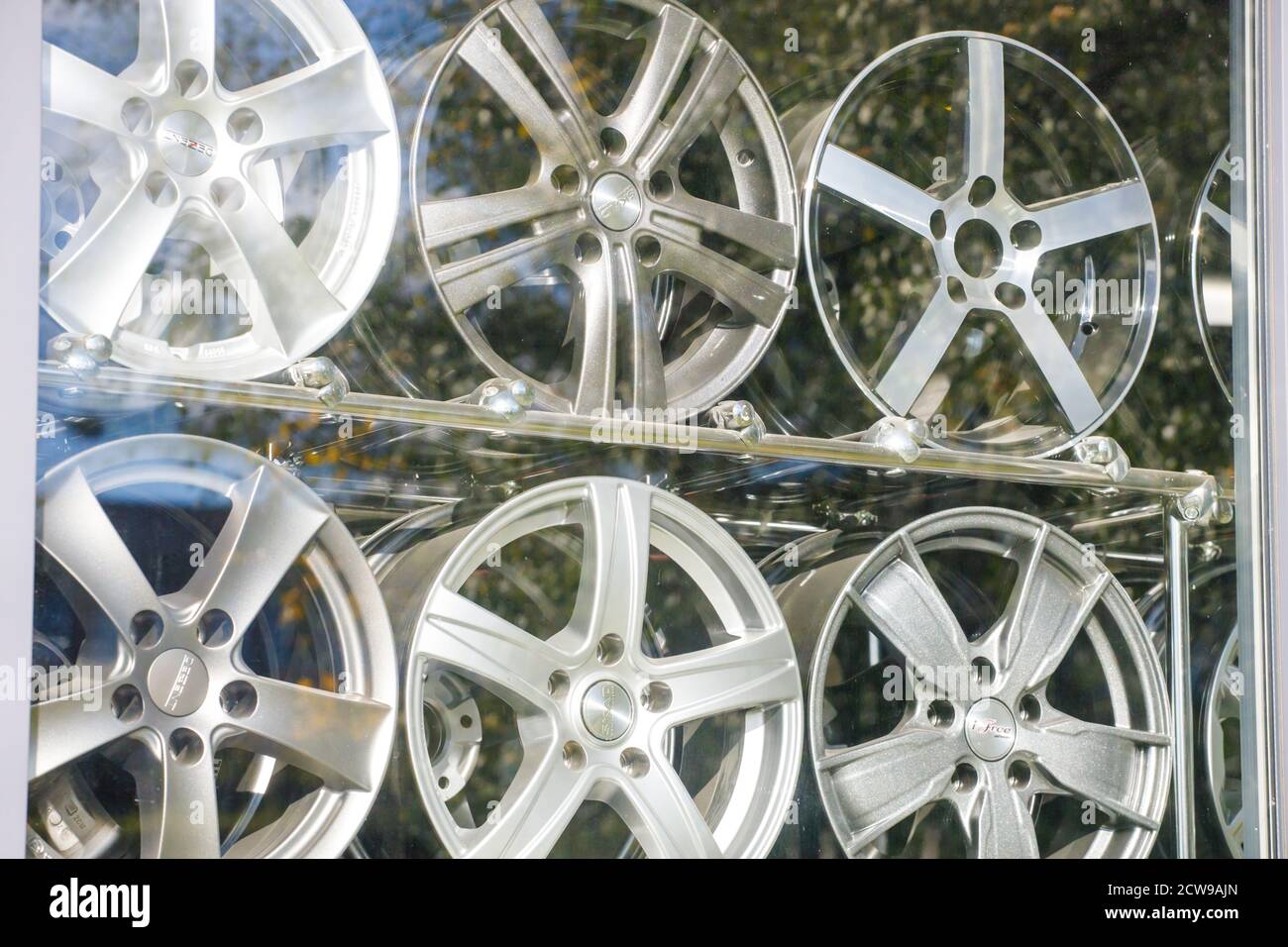 Russia Vyborg. 09.09.2020 Car rims in the shop window behind the glass ...