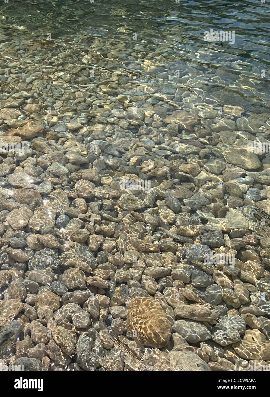 Crystal clear water background. Scenic pebble beach. Calm Adriatic ...