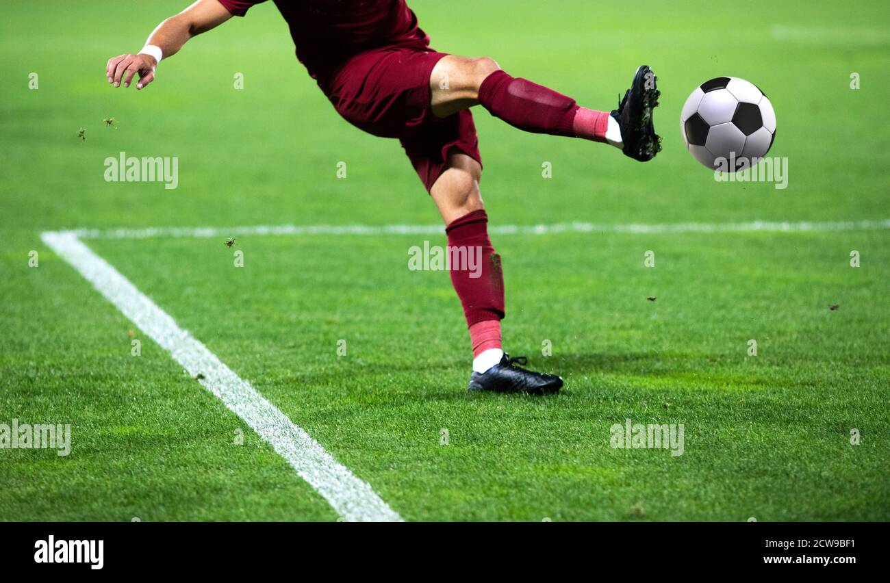 soccer game background player kicking football Stock Photo - Alamy