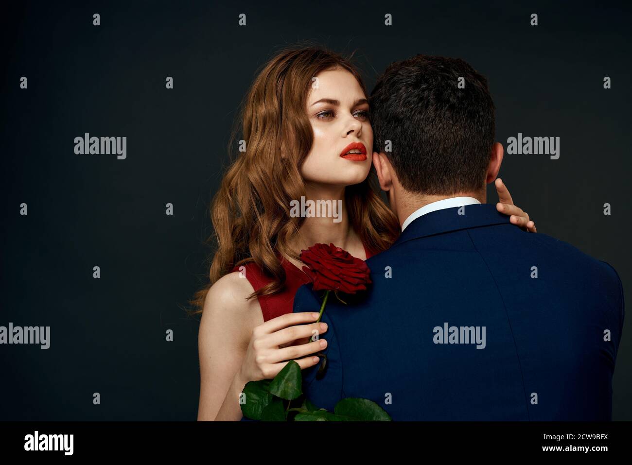 luxury couple hug romance relationship rose over dark isolated ...