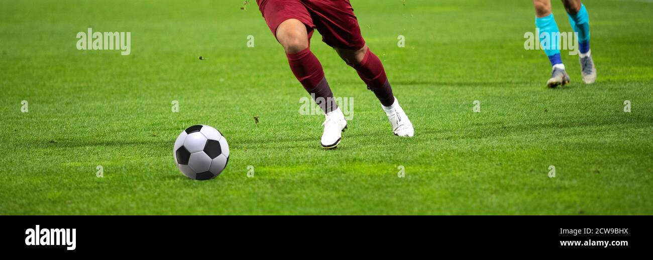 soccer game background player kicking football Stock Photo - Alamy