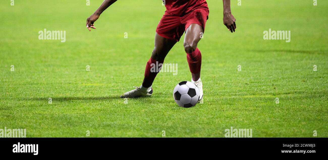 soccer game background player kicking football Stock Photo - Alamy