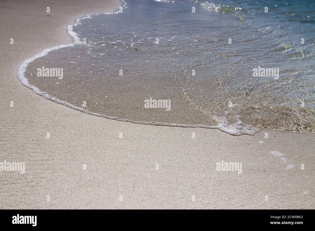 Water of the sea on the wet sand Stock Photo - Alamy