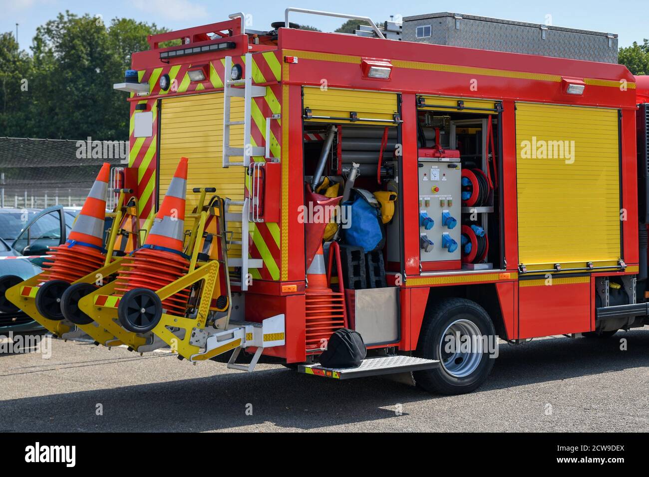 Big red fire truck with fire equipment Stock Photo - Alamy