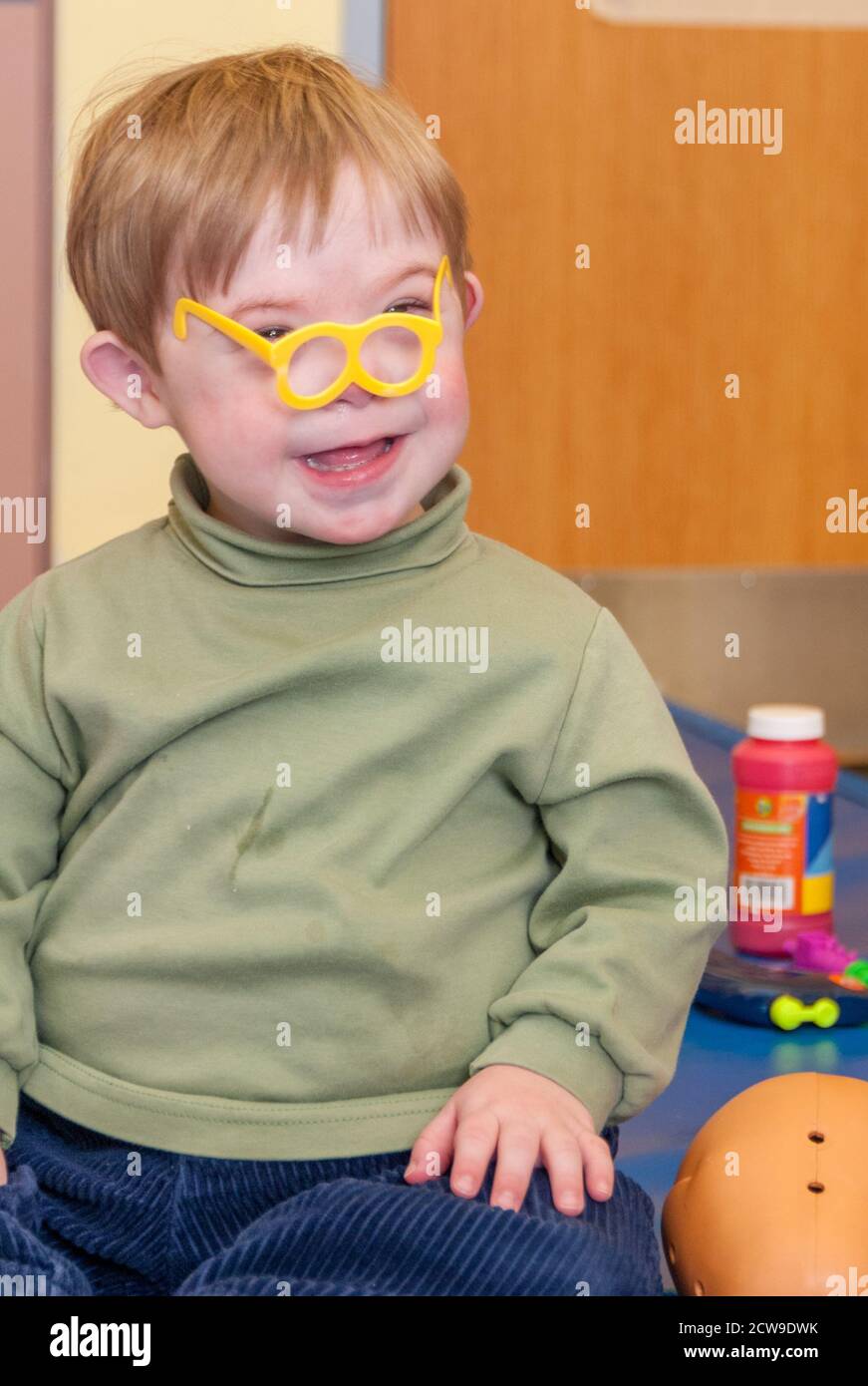 Charlie, a child with Down's Syndrome, goes to therapy every day to ...