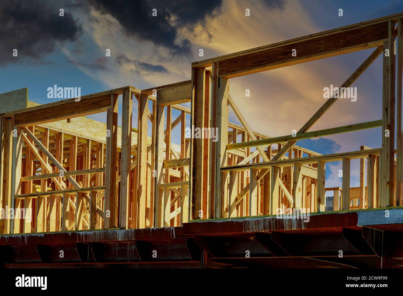 New residential construction home framing home against a dramatic ...