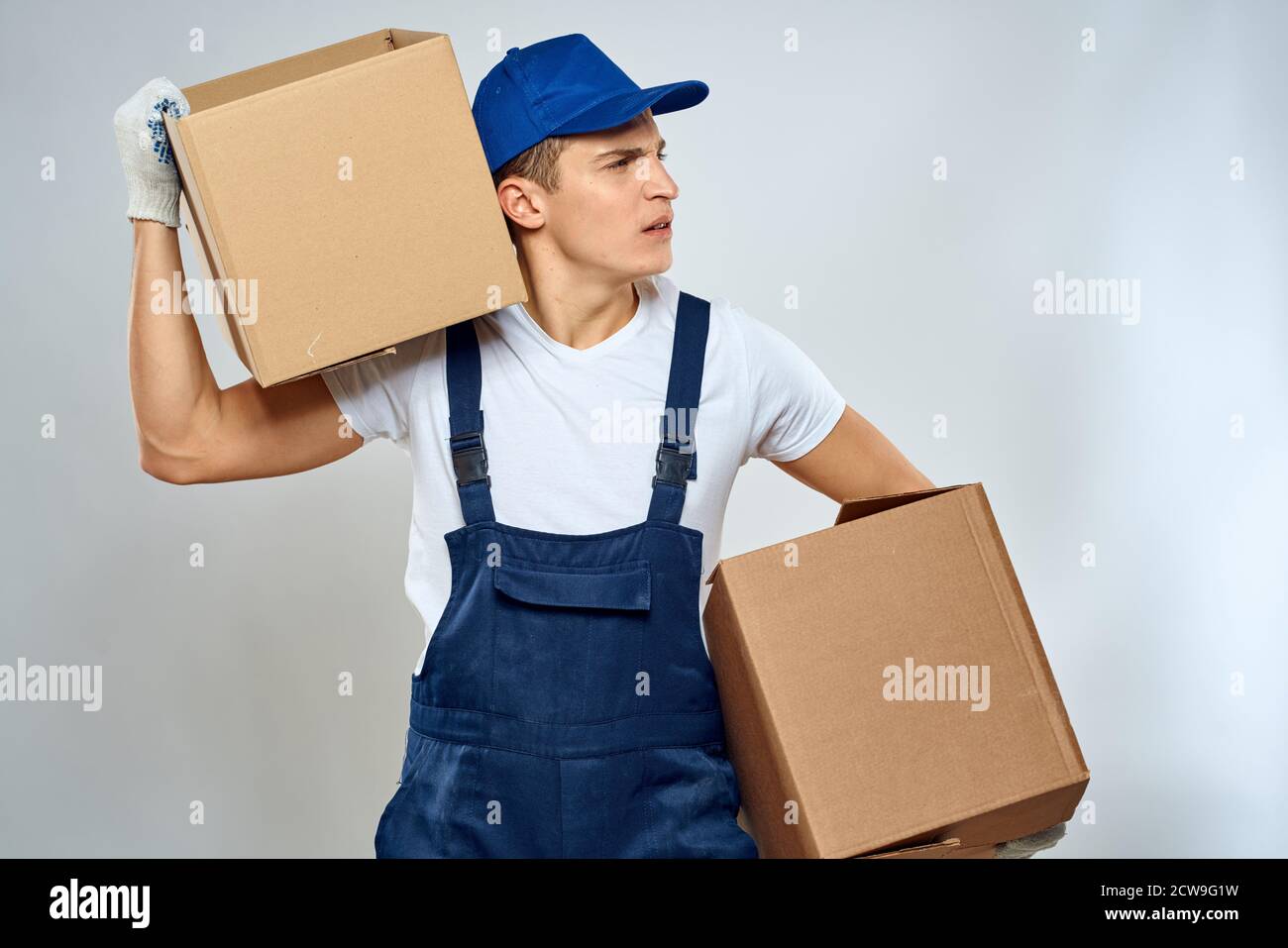 Man worker with box in hands delivery loading service packing service ...