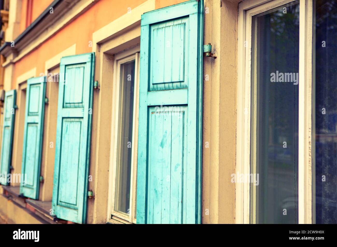 Exterior view of windows with open shutters Stock Photo - Alamy