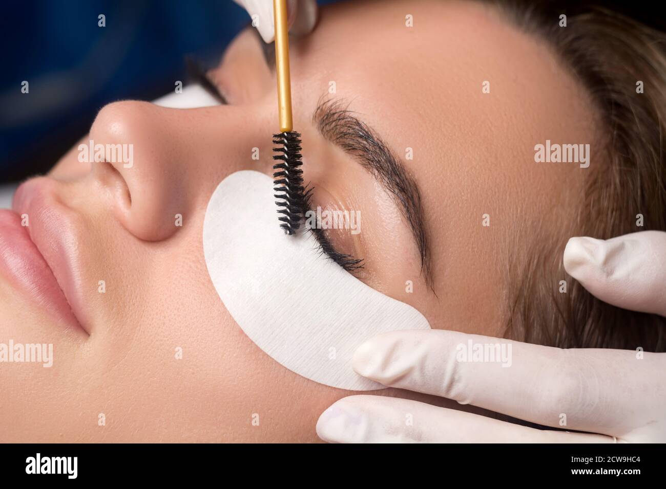 Woman with long lashes in a beauty salon. Eyelash extension Stock Photo ...