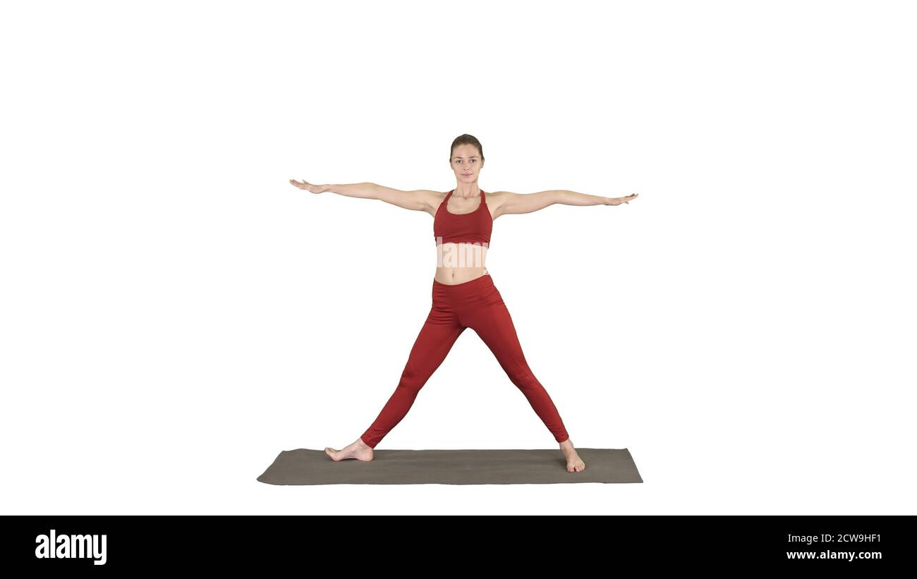 Woman practicing yoga, standing in Extended Side Angle exercise Stock ...